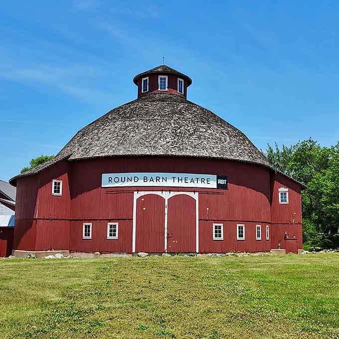 The Round Barn Theatre's distinctive shape makes it impossible to miss, like someone decided barns deserved their moment in the spotlight.