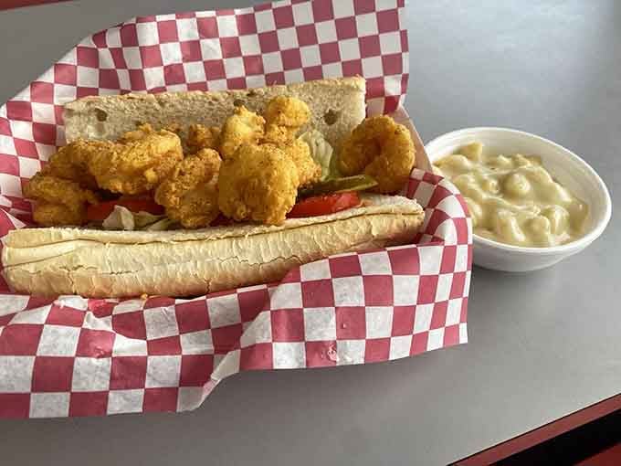 Golden fried shrimp nestled in fresh bread with all the toppings makes this po'boy an absolute work of art.