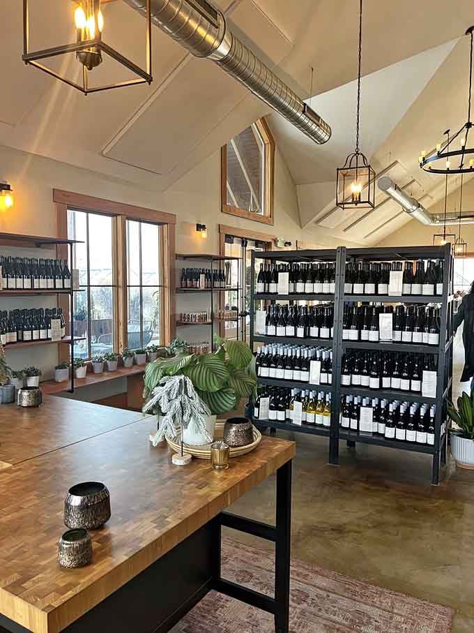 The tasting room interior combines rustic charm with modern elegance, like if a barn went to design school.