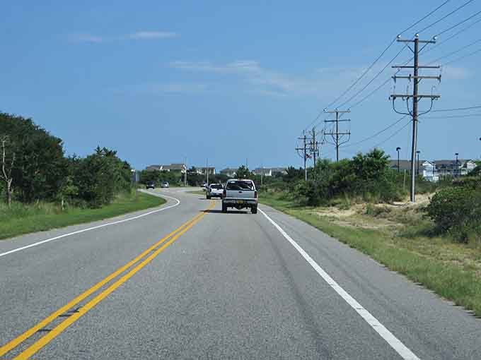 The open road stretches ahead like an invitation you can't refuse, promising adventure around every gentle curve.
