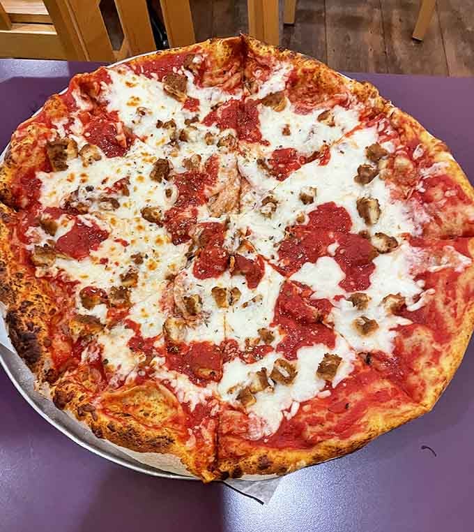 Sausage and pepperoni loaded onto a whole pie means someone understands that more is sometimes absolutely necessary.