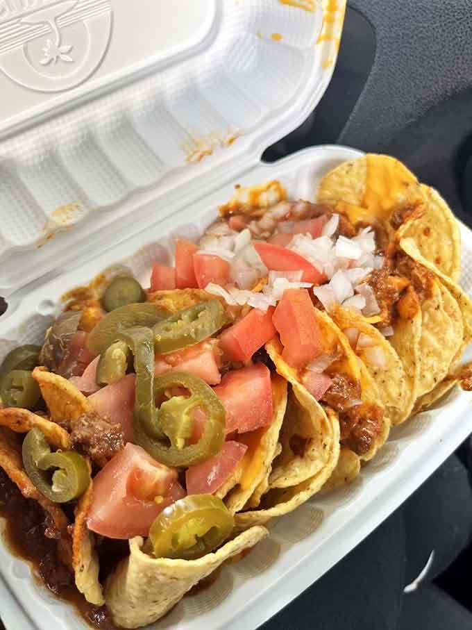 Nachos loaded with enough toppings to require a strategic eating plan and possibly a forklift.