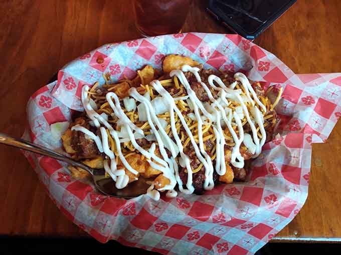 Chili cheese curds drizzled with sauce, proving Wisconsin knows exactly what the people want and need right now.