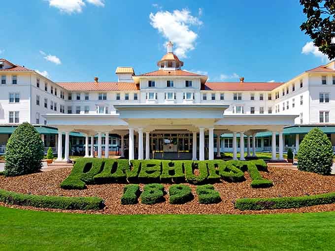 The Carolina Hotel's manicured hedges spell out exactly what kind of refined experience awaits inside those elegant doors.