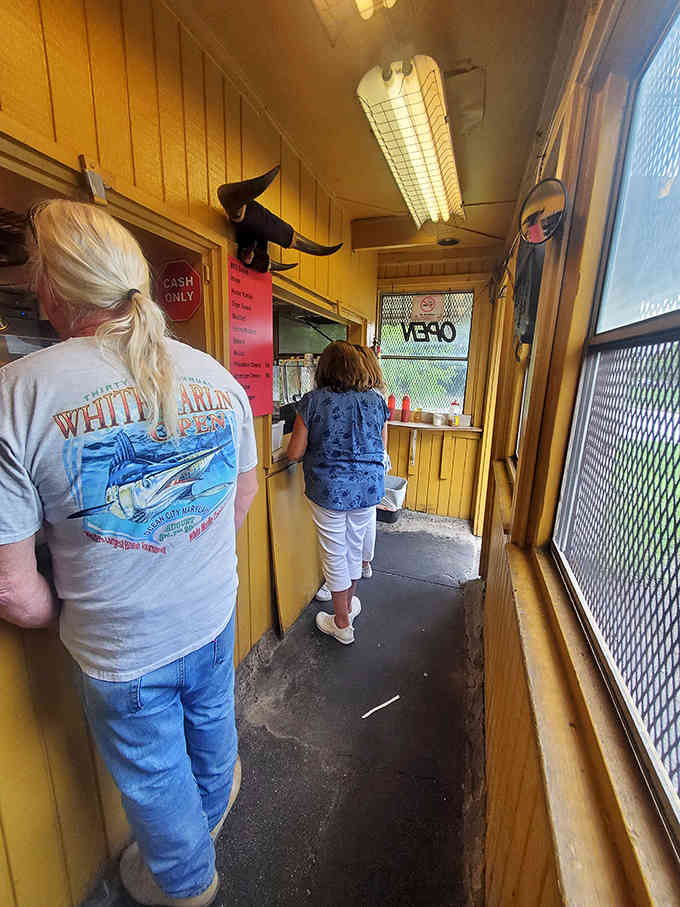 The ordering corridor where dreams are placed and hunger meets its match, one customer at a time.