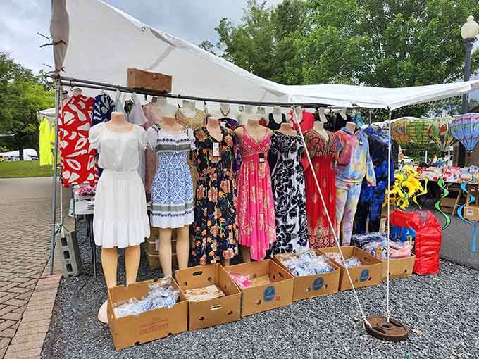 Summer dresses hanging like a rainbow of possibilities, each one ready to make someone's warm weather wardrobe complete.