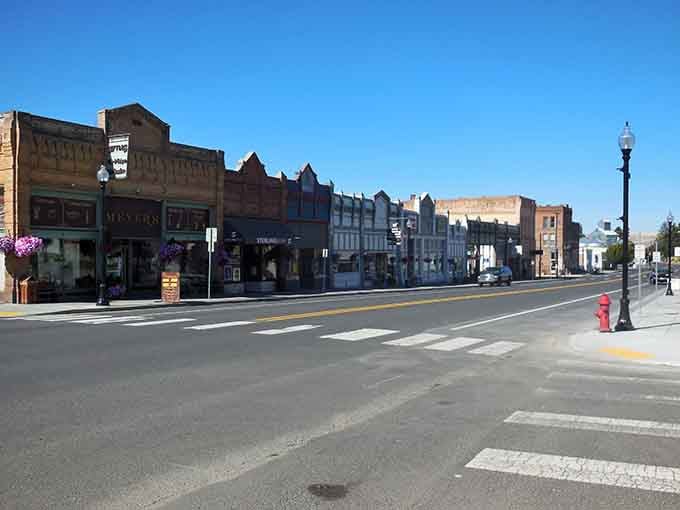 Main Street shops display hanging baskets and genuine hospitality that big-box stores forgot existed decades ago.