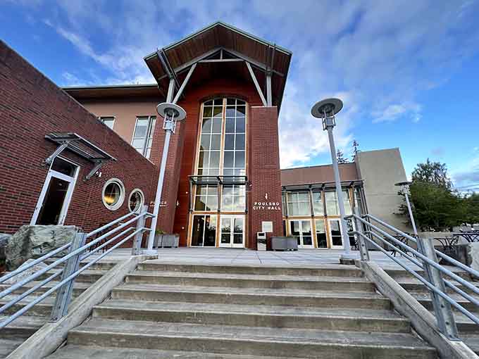 Modern brick and soaring windows create a civic building that balances contemporary function with architectural warmth and accessibility.