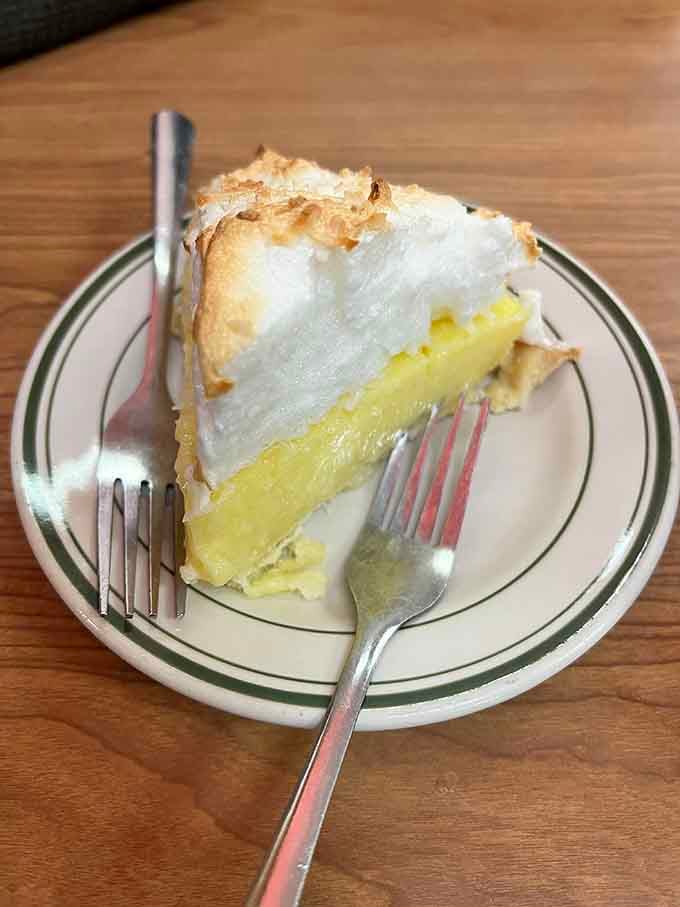 Lemon meringue pie with peaks so perfect they deserve their own mountain range designation and hiking trails.
