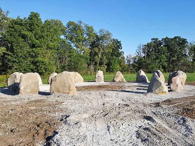 Carved stones arranged in ceremonial formation honor the tribes whose footsteps once echoed across these very grounds.