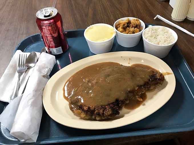 Pepper steak smothered in gravy with rice and sides: this is cafeteria-style done absolutely right, no apologies needed.