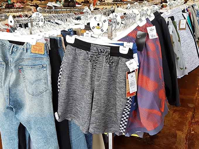 Vintage denim and athletic shorts coexist peacefully, unlike your wardrobe's constant identity crisis at home.