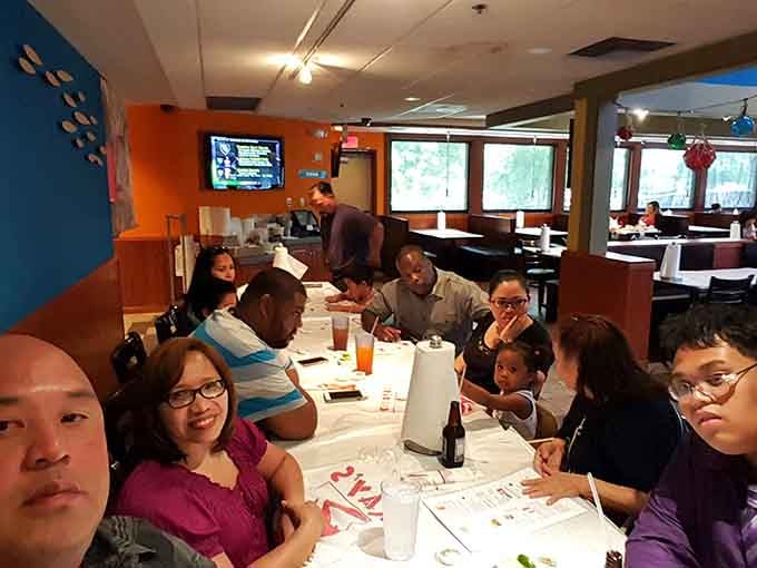 Family gatherings at Ray's prove that the best conversations happen when everyone's hands are covered in delicious seasoning.