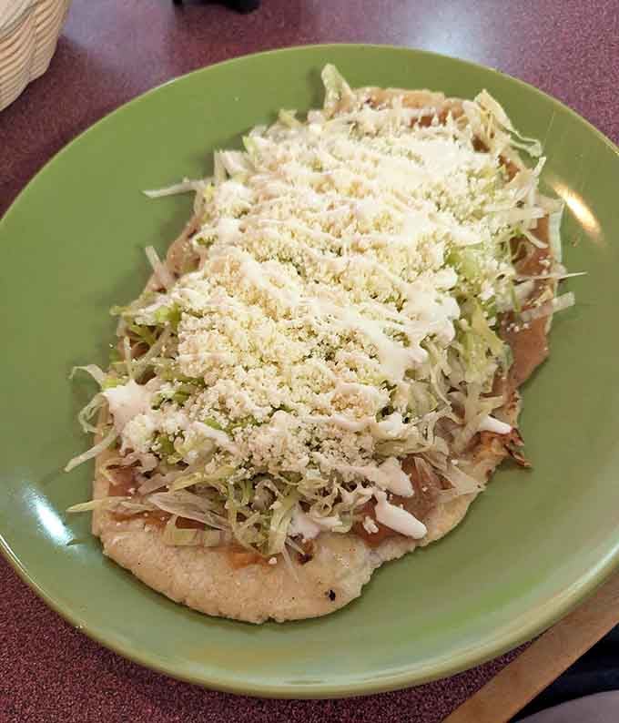 Huaraches topped with lettuce, cheese, and crema prove that sometimes the best dishes are the ones you've never heard of.