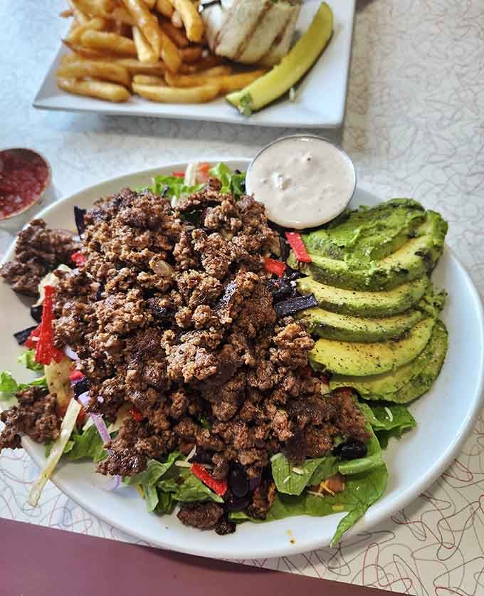 That taco salad comes loaded with seasoned beef and fresh avocado, making healthy eating look downright indulgent.