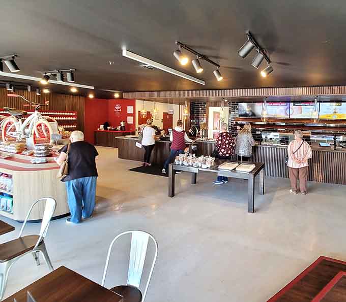 The universal stance of bakery customers: contemplating life's sweetest decisions with appropriate reverence and focus.