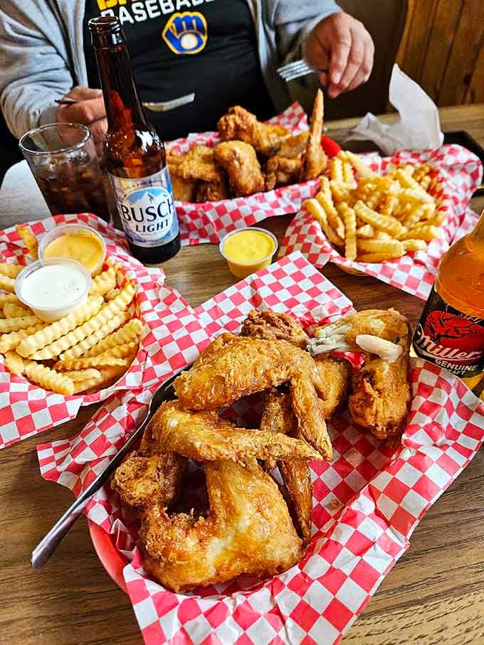 Crispy wings, crinkle fries, and cold beer, the holy trinity of Wisconsin bar food done absolutely right.