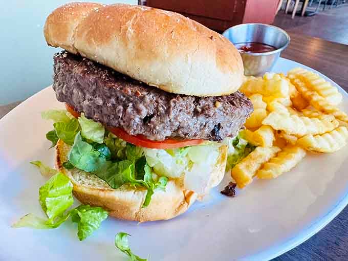 Sometimes you need a break from oysters, and this juicy burger with crispy fries delivers beautifully.