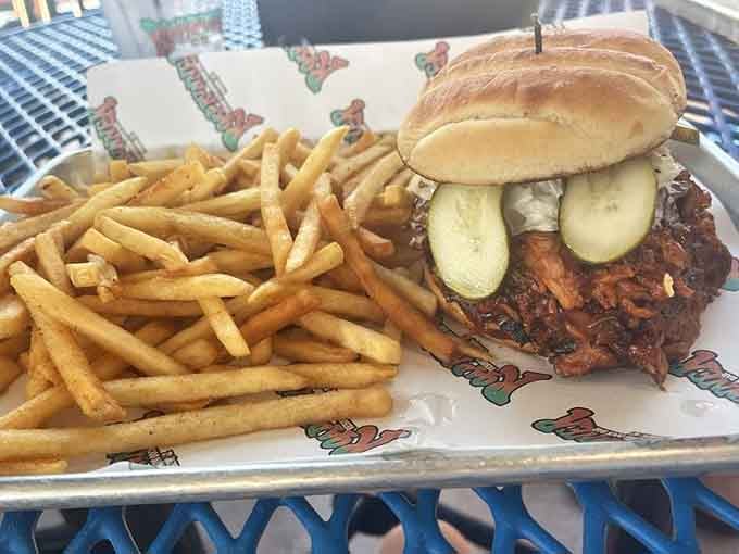 Pulled pork piled high on a bun with fries proves that comfort food floats just as well as boats.