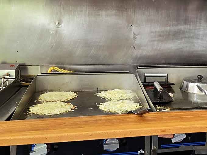 Watch the magic happen on that griddle where hash browns transform into crispy golden perfection.