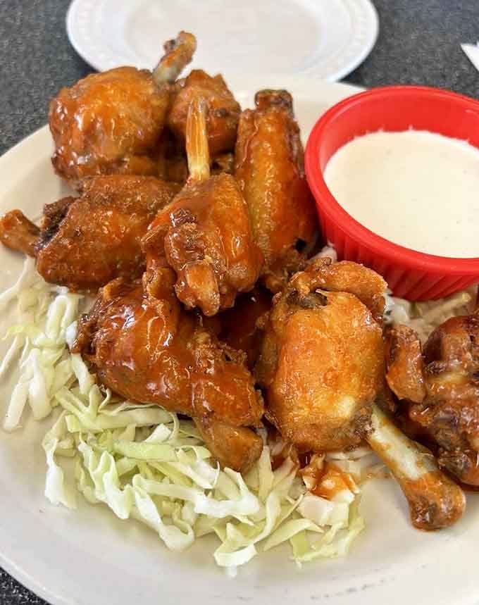 Sticky, saucy buffalo wings piled high with ranch dressing make you forget you're sitting in a train car.