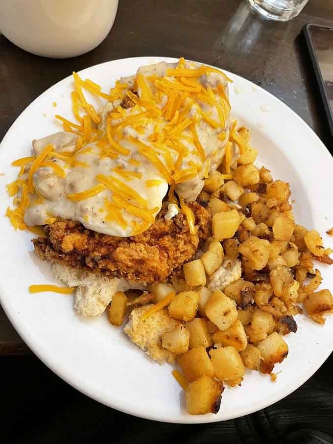 The Pork Tenderloin Benny sits there looking like it just won breakfast, which it absolutely did.