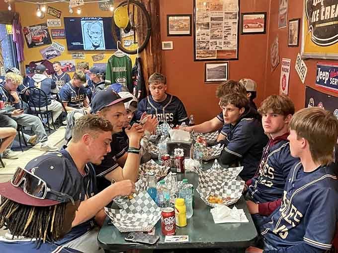 Nothing says community like a team gathering around checkered baskets full of hot dogs and good times.