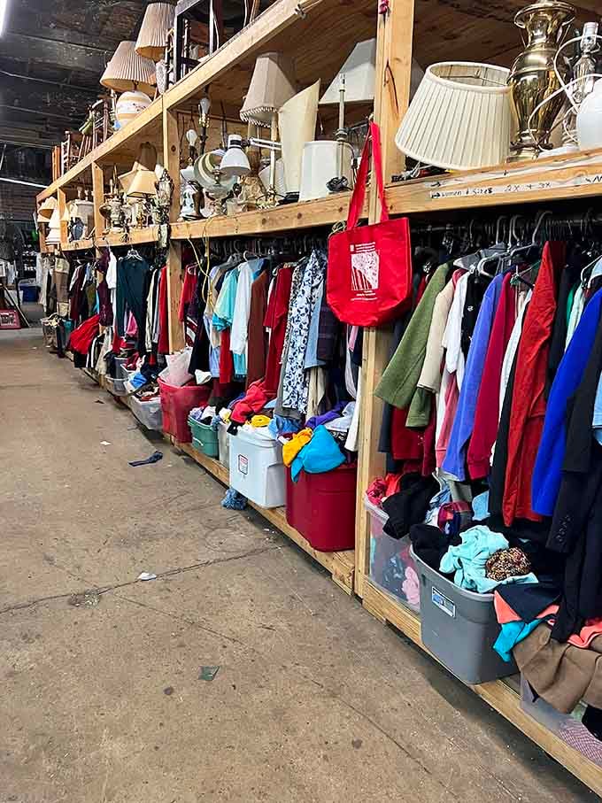 Vintage clothing and lamps sharing shelf space like old friends who've seen better days but still clean up nice.