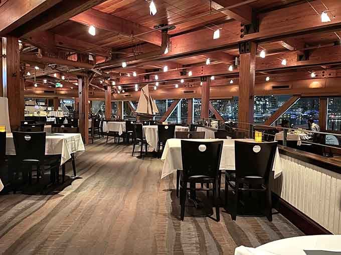 Crisp white tablecloths and wooden beams set the stage for meals that become cherished memories instantly.