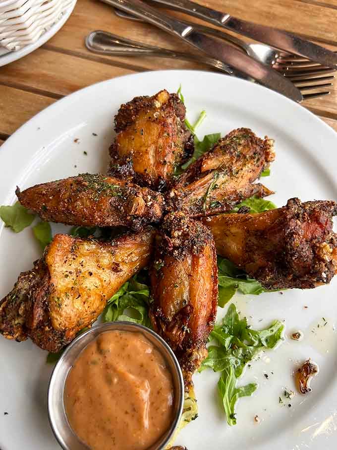 Crispy chicken wings with a side of sauce that'll make you forget you were planning to order something "lighter" today.