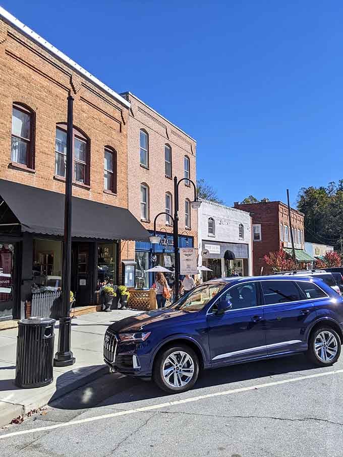 Historic storefronts line up like old friends at a reunion, each with stories etched into their weathered brick.
