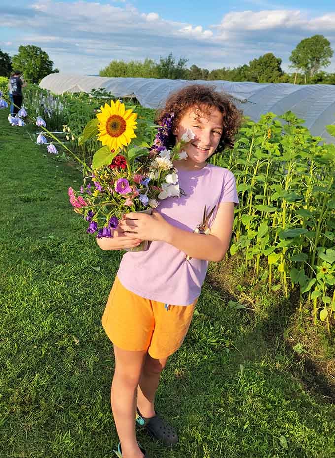 Pure joy captured in a single moment: fresh flowers, golden hour light, and the unmistakable grin of success.