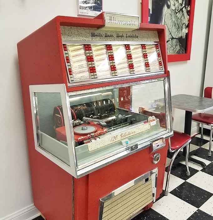 A classic jukebox stands ready to soundtrack your sundae with hits from when music had actual melodies.