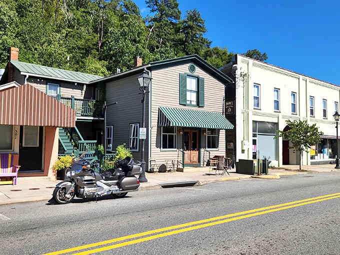 Colorful storefronts line streets where the biggest rush hour involves maybe three cars and a wandering dog.