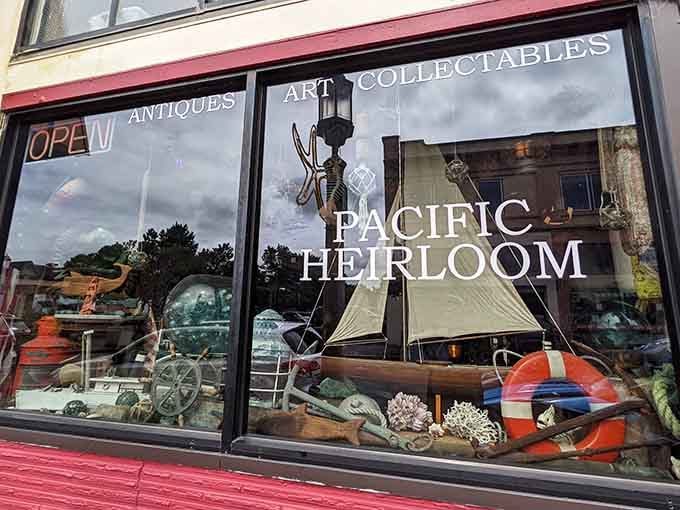 Pacific Heirloom's window display teases passersby with nautical treasures and coastal collectibles that tell a thousand salty sea stories.