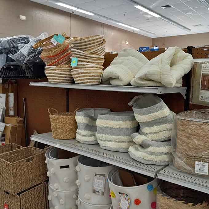 Woven baskets and textured pillows stacked high create that cozy home aesthetic Martha Stewart would approve of, budget permitting.