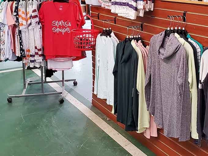 "Stars and Stripes" tees hanging alongside sweaters, because patriotism and warmth go hand in hand here.