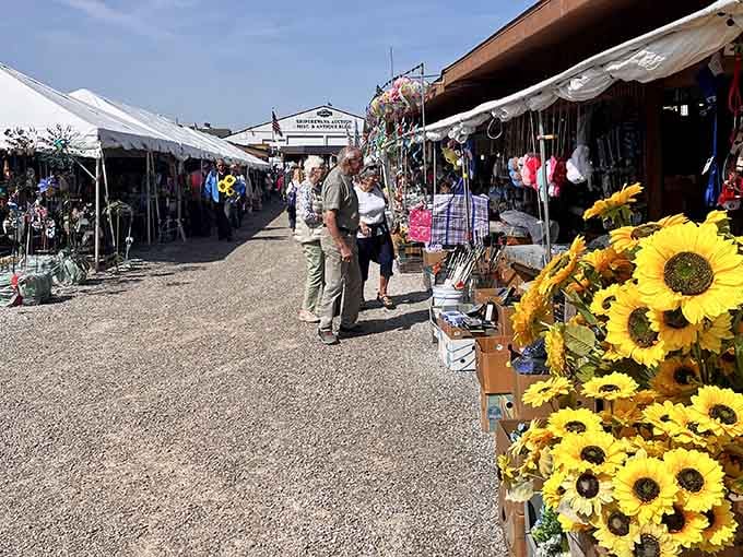 The flea market buzzes with shoppers hunting treasures among sunflowers that are almost as cheerful as the vendors.