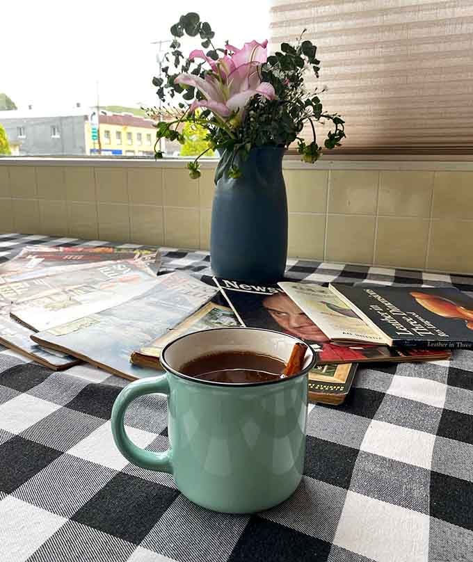 Hot apple cider served with reading material: the perfect recipe for slowing down and savoring life.