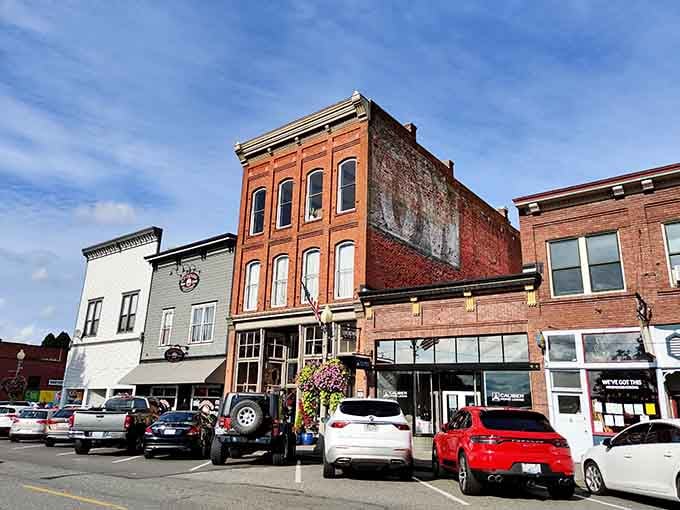 Weathered brick facades tell stories of commerce spanning generations, each building a chapter in the town's ongoing narrative.