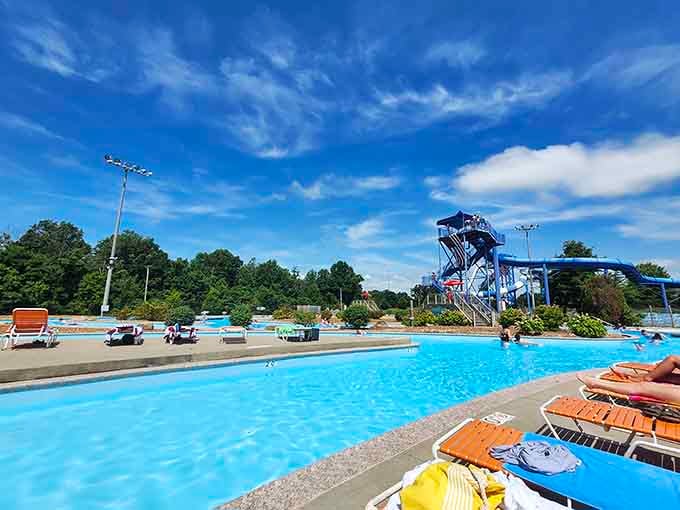 Crystal-clear water beckons under perfect skies while that impressive slide tower looms in the distance temptingly.