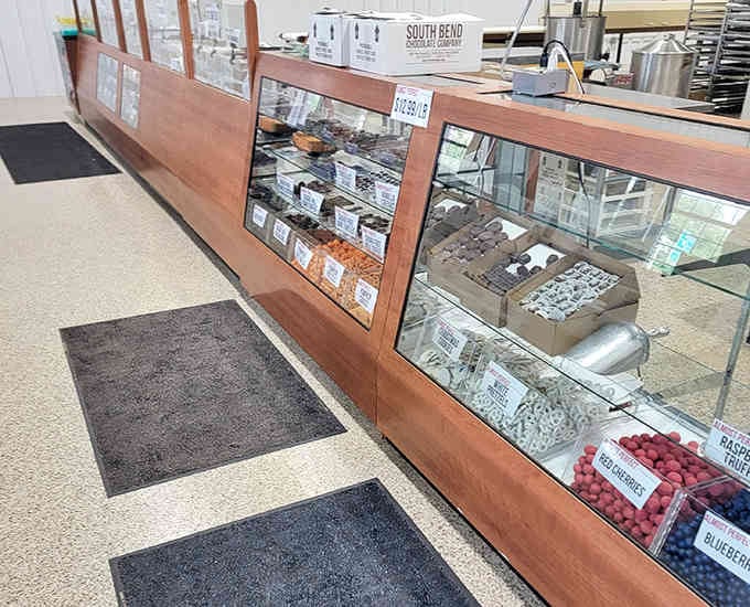 Behind glass cases, handcrafted chocolates wait patiently like edible jewels ready for their forever homes.