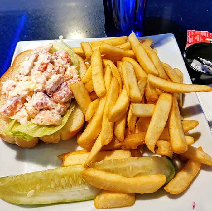 A lobster roll bursting with meat alongside golden fries proves Boston knows exactly what it's doing with seafood.