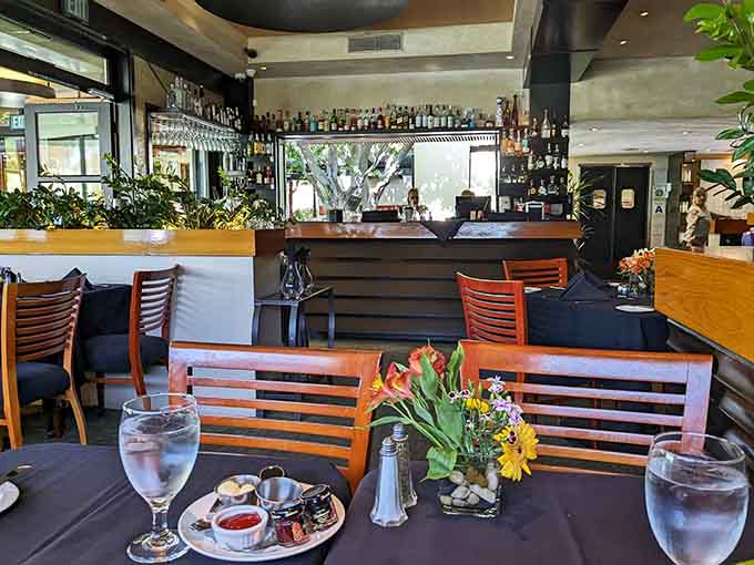 The bar area offers front-row seats to watch skilled bartenders work their liquid magic nightly.