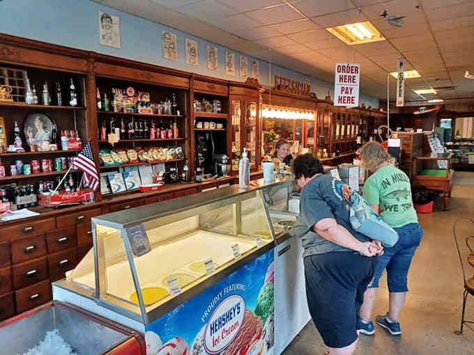 The counter where strangers become friends, united by their mutual appreciation for hand-dipped ice cream and nostalgia.