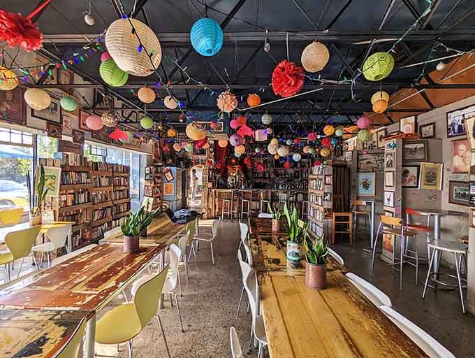 Long communal tables invite conversation while colorful lanterns create an atmosphere that's part coffee shop, part art installation, all magic.