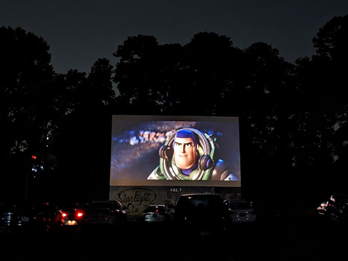 Buzz Lightyear goes to infinity and beyond, literally towering over the cars below in glorious outdoor cinema fashion.