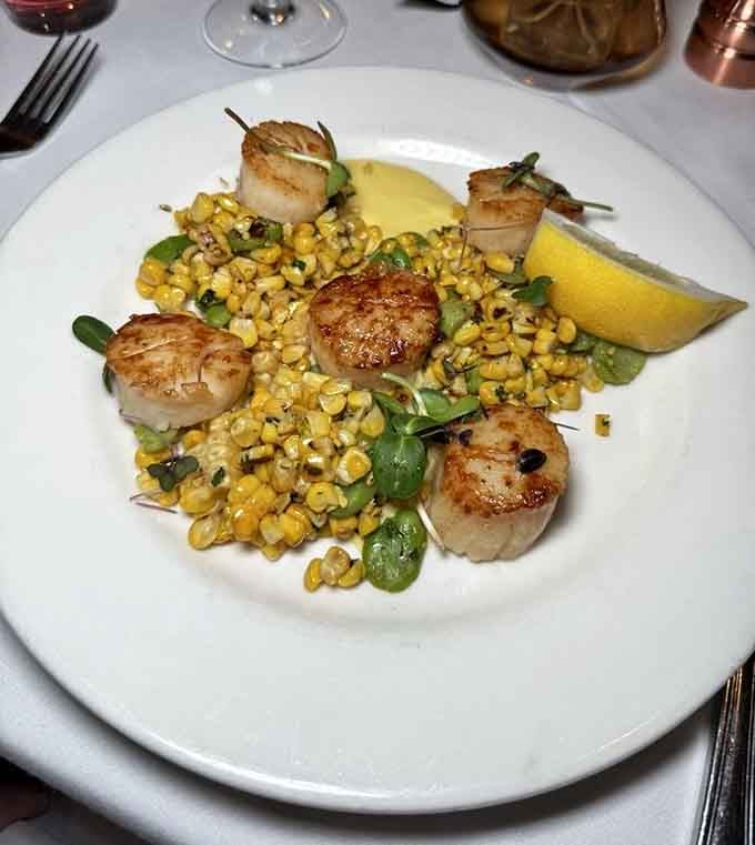 Perfectly seared scallops over corn succotash prove that surf without turf can be just as satisfying when executed this beautifully.