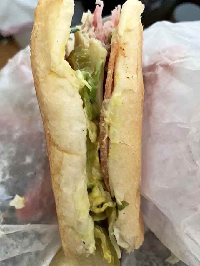 Look at those pickles peeking out, providing the tangy crunch that makes every bite a perfectly balanced flavor explosion.