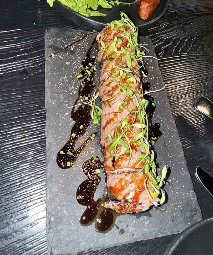 Gourmet wagyu sushi rolls drizzled with savory sauce and fresh microgreens offer you a truly decadent dining experience.